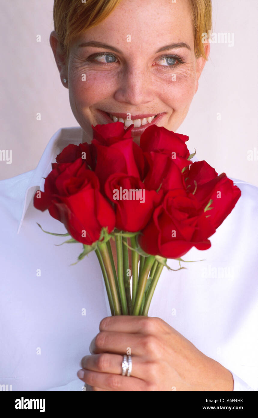 Woman with red roses Stock Photo - Alamy