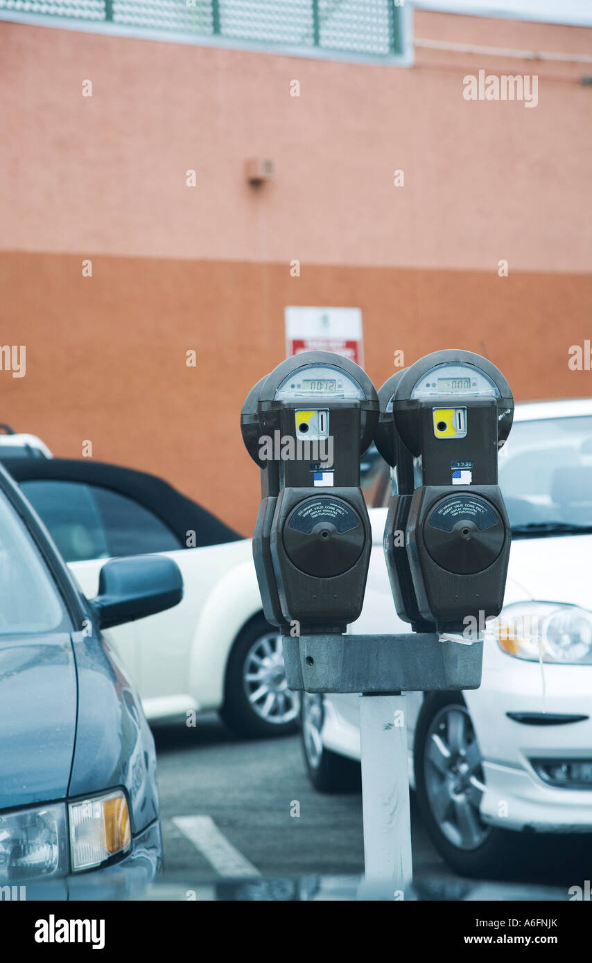 Parking meters and parked cars Stock Photo - Alamy