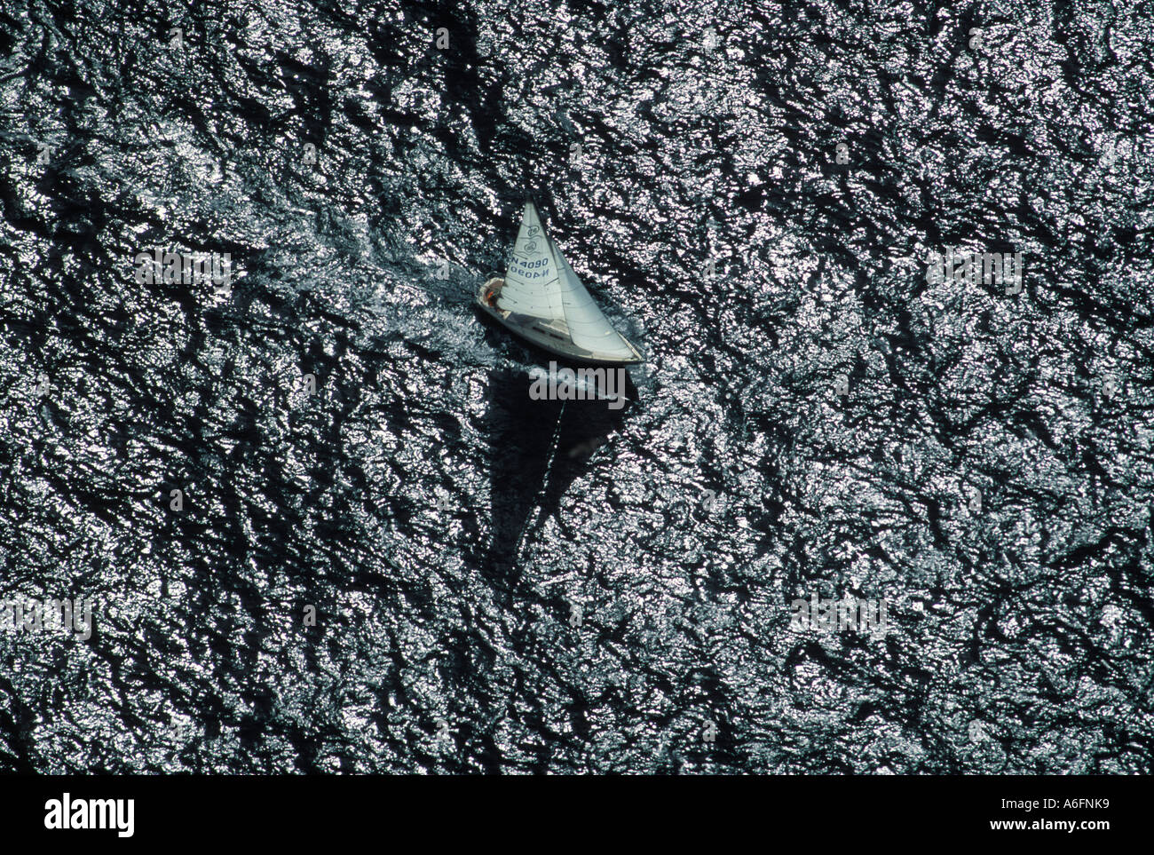 Sailing boat on reflecting Sea from above Stock Photo - Alamy