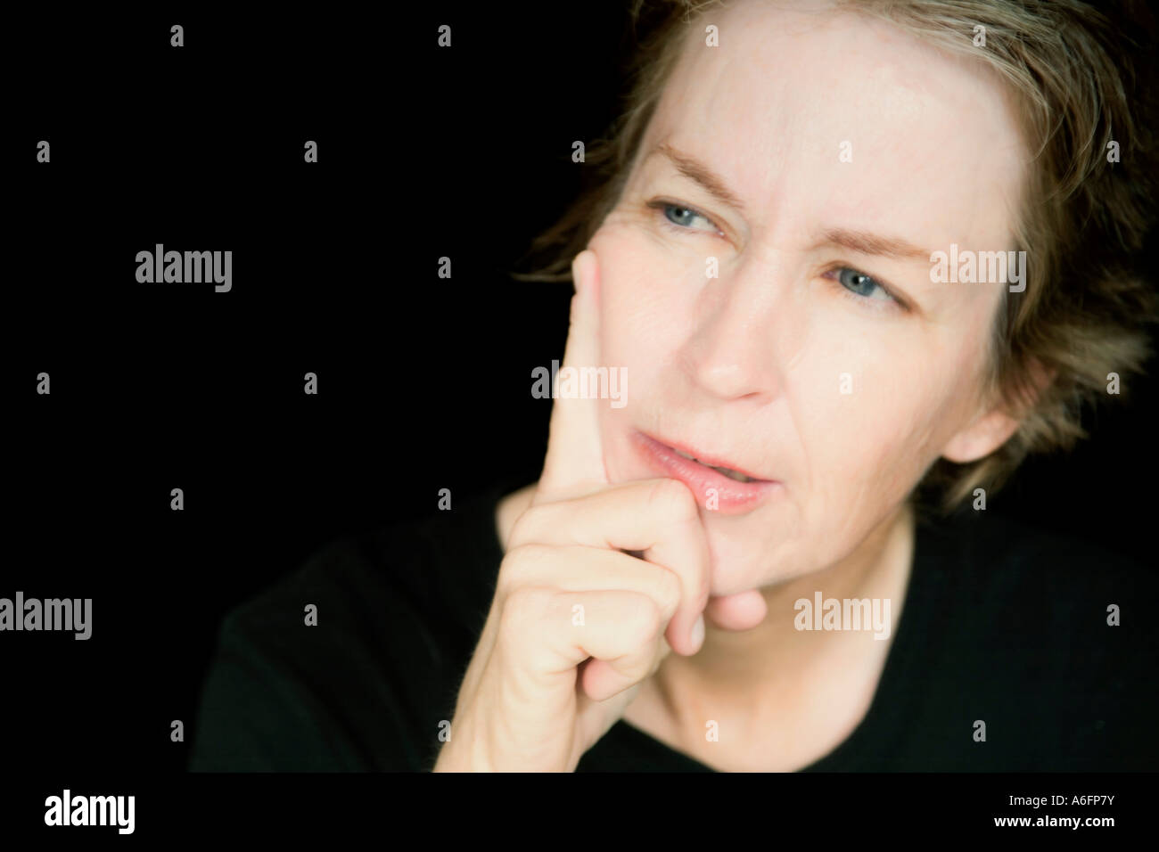 Concentration woman cheek hi-res stock photography and images - Alamy