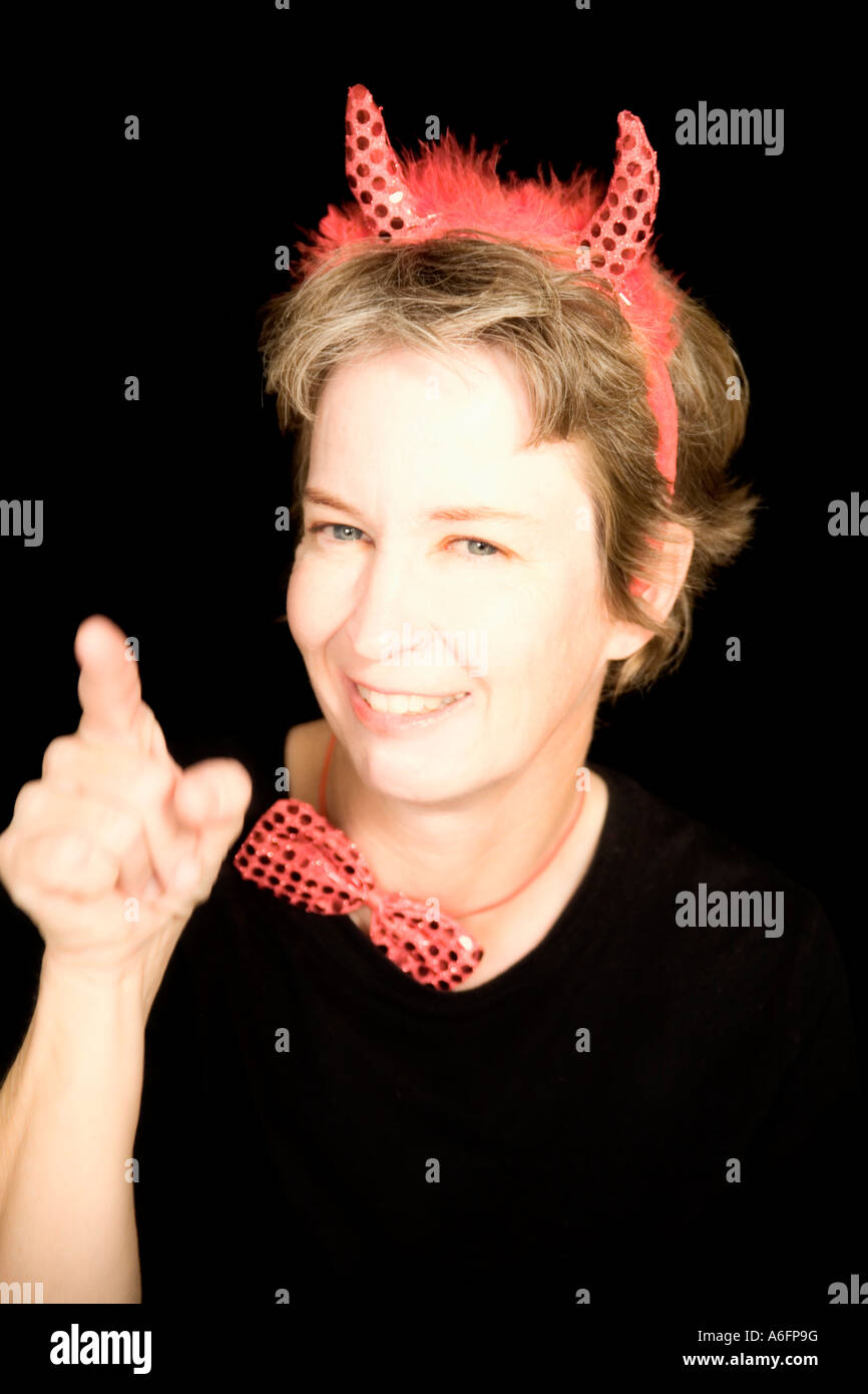 Woman wearing devil horns hi-res stock photography and images - Alamy