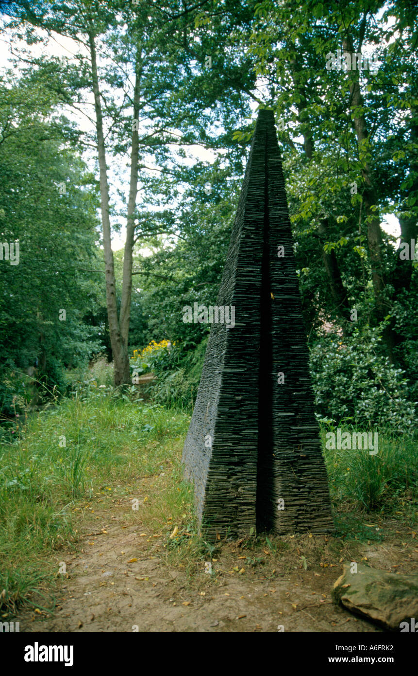 Abstract Sculpture of pointed spire in Hannah Peschar outdoor water ...