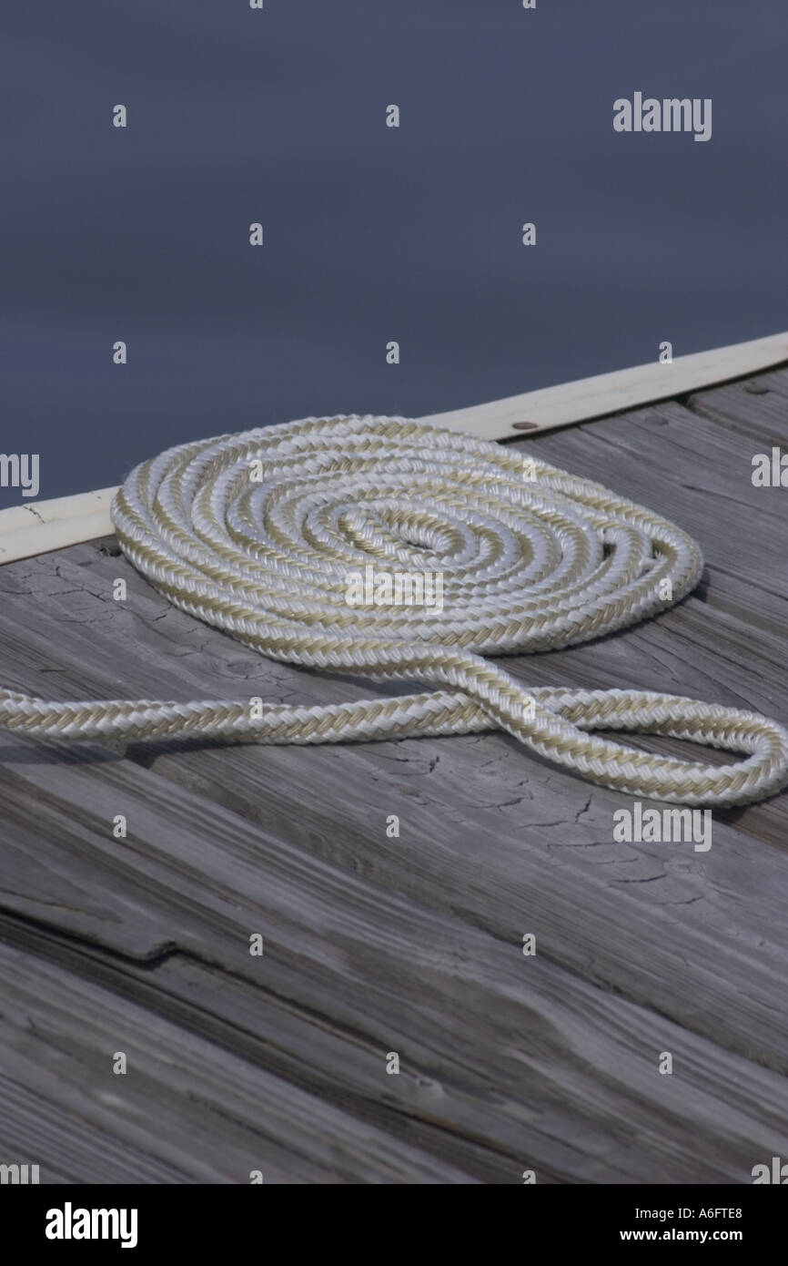 rope coiled on dock Stock Photo - Alamy