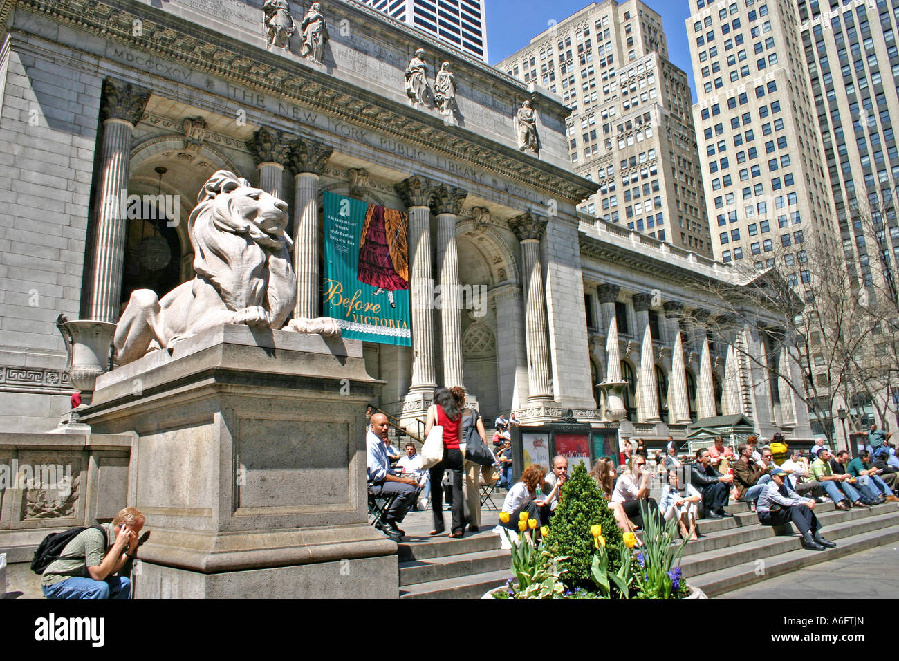 People sitting on steps sunny day New York Public Library Fifth Avenue ...