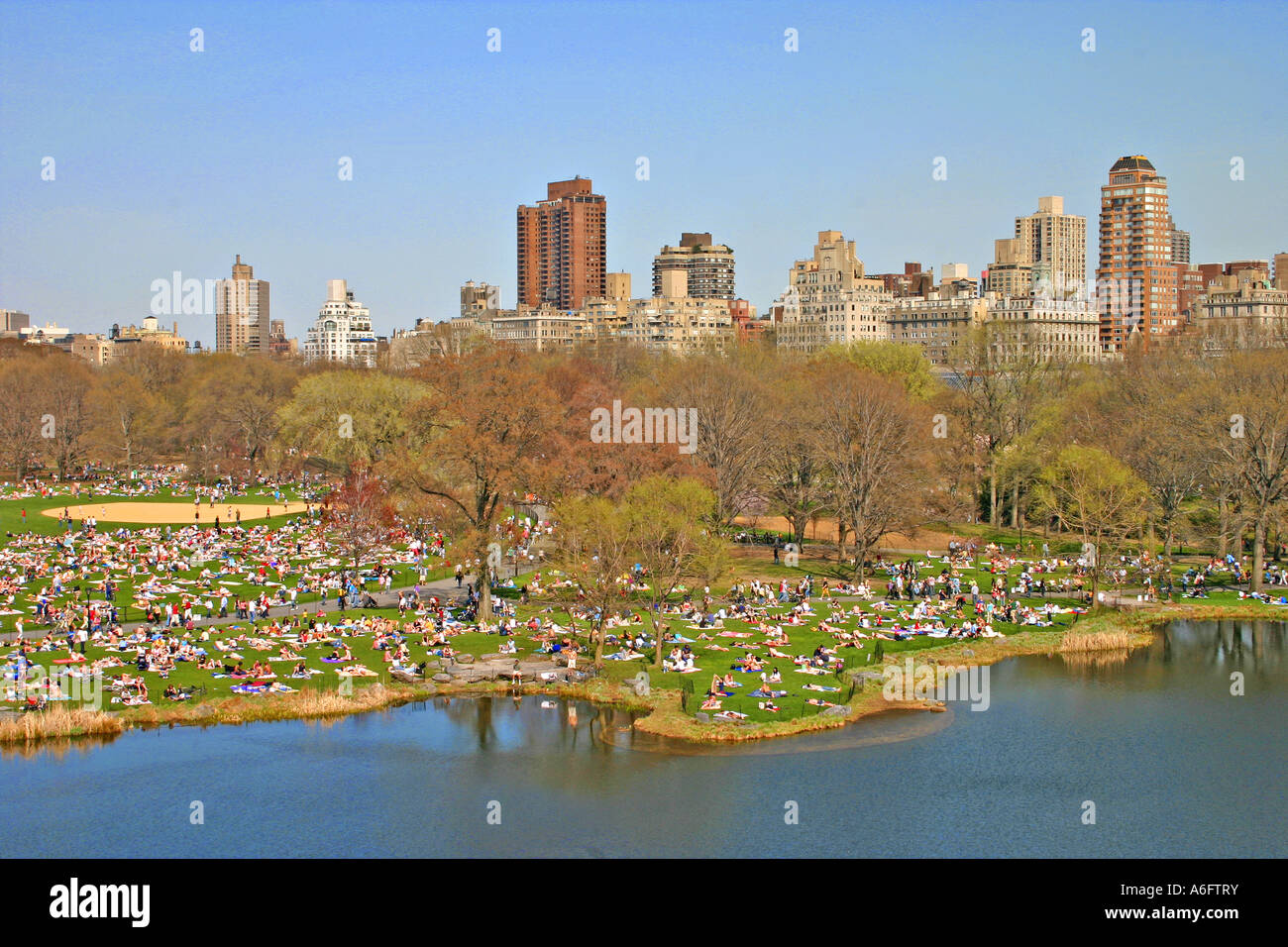 Springtime crowds on Great Lawn overlooking Upper Manhattan Central ...