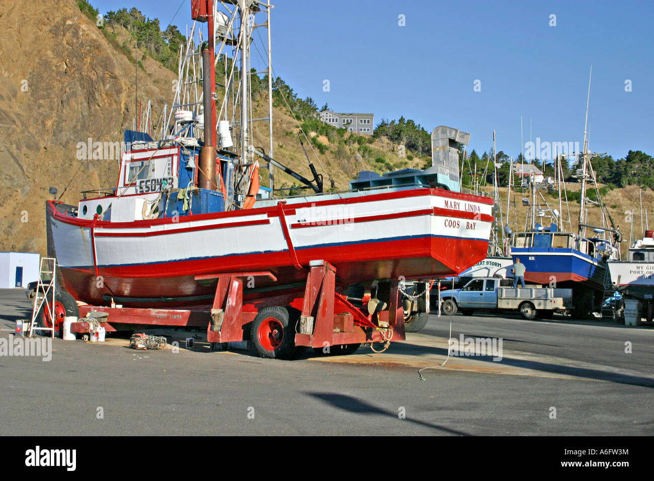 Fishing boats up on wharf in harbor at Port Orford Oregon Stock Photo ...