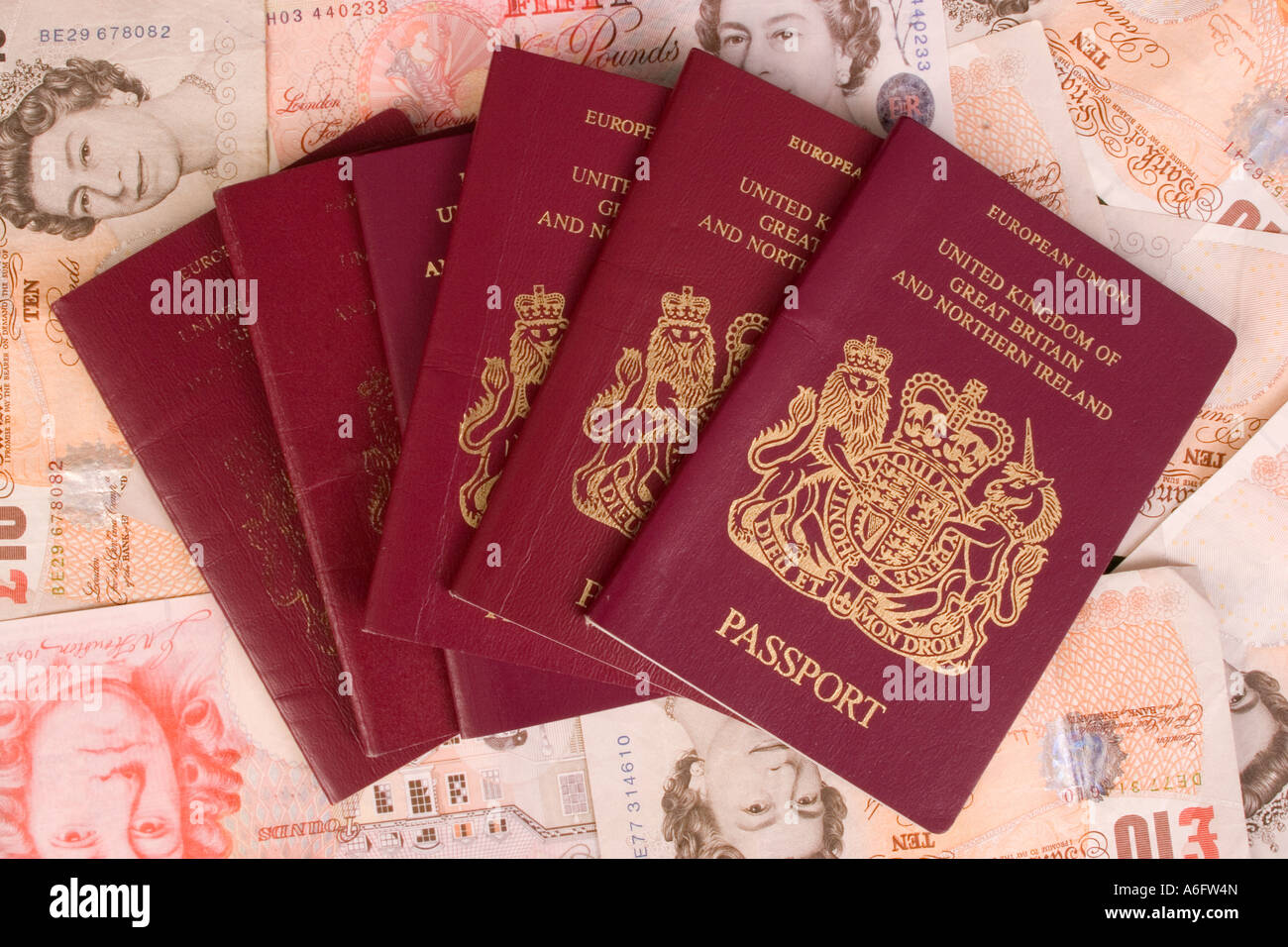 Passports for money Stock Photo - Alamy