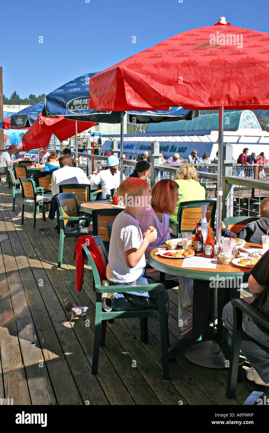 Family dining on deck at Port Dock restaurant at Newport Oregon Stock ...