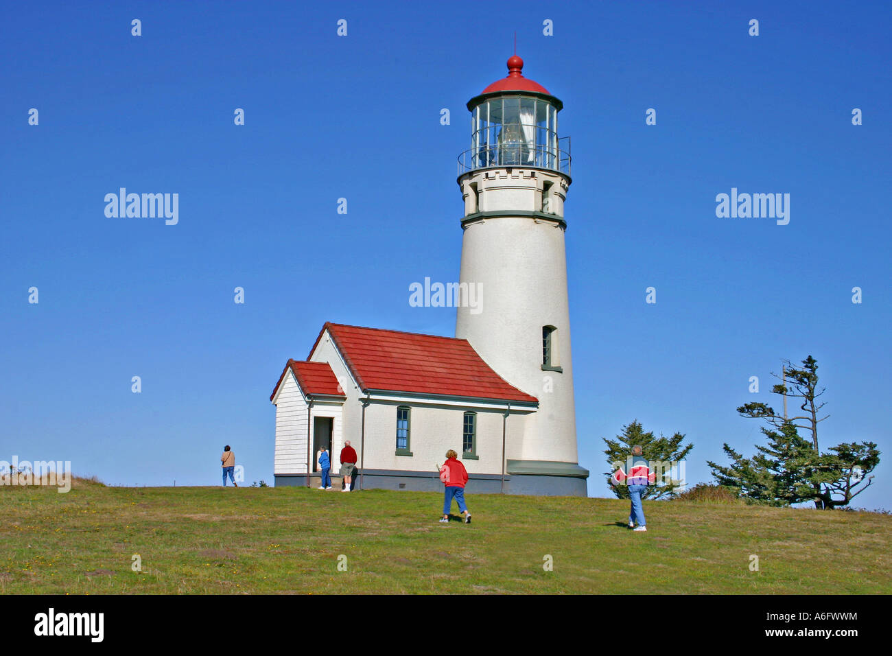 People on tour at lighthouse in Cape Blanco State Park near Port Orford ...