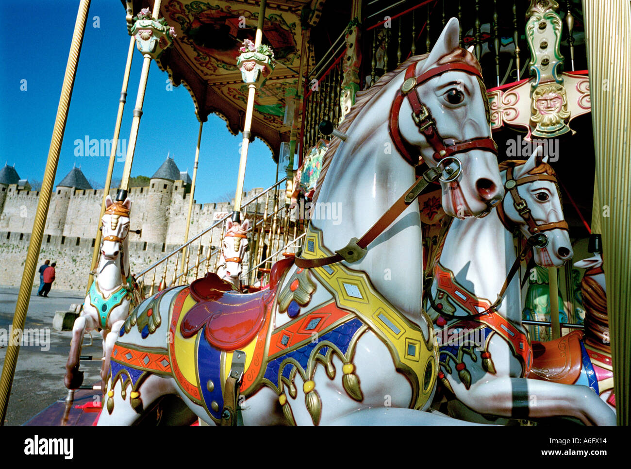 A colourful carnival merry go round photographed at the entrance to the ...