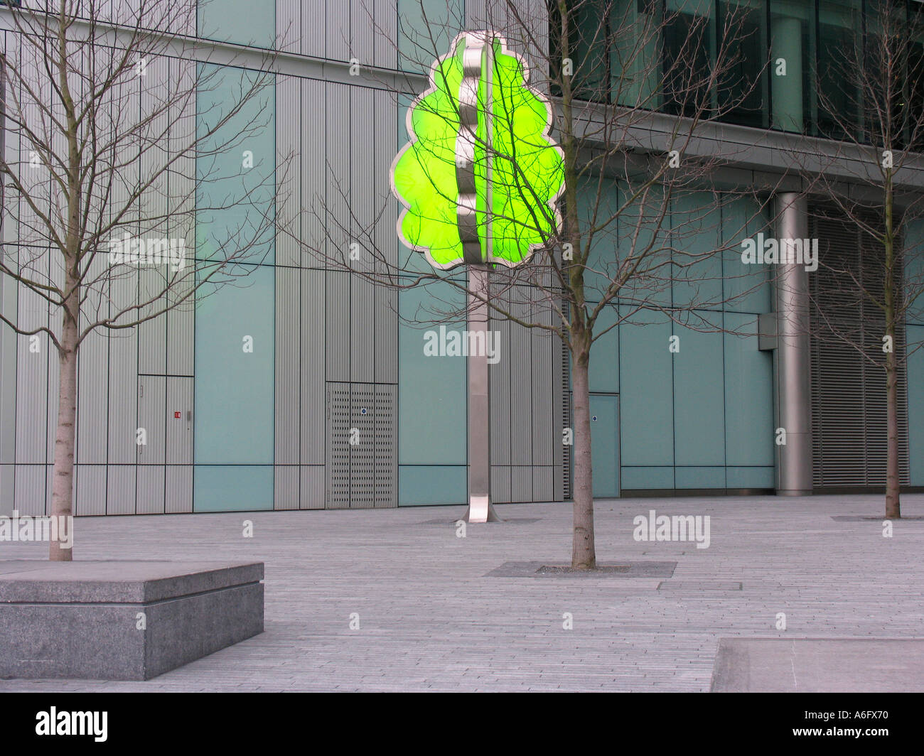 A tree sculpture next to a modern office building Stock Photo - Alamy
