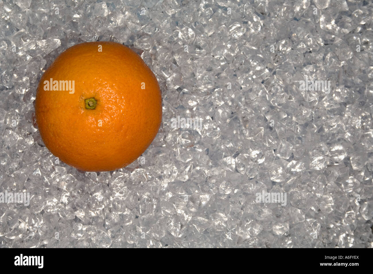 Orange on bed of crushed ice Stock Photo - Alamy