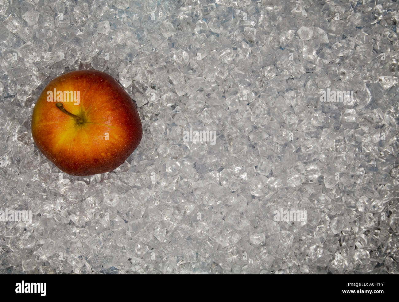 One Apple on bed of crushed ice Stock Photo - Alamy