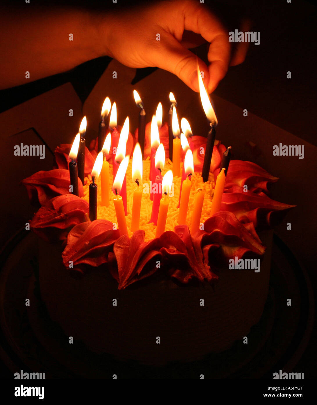 Lighting birthday candles Stock Photo - Alamy