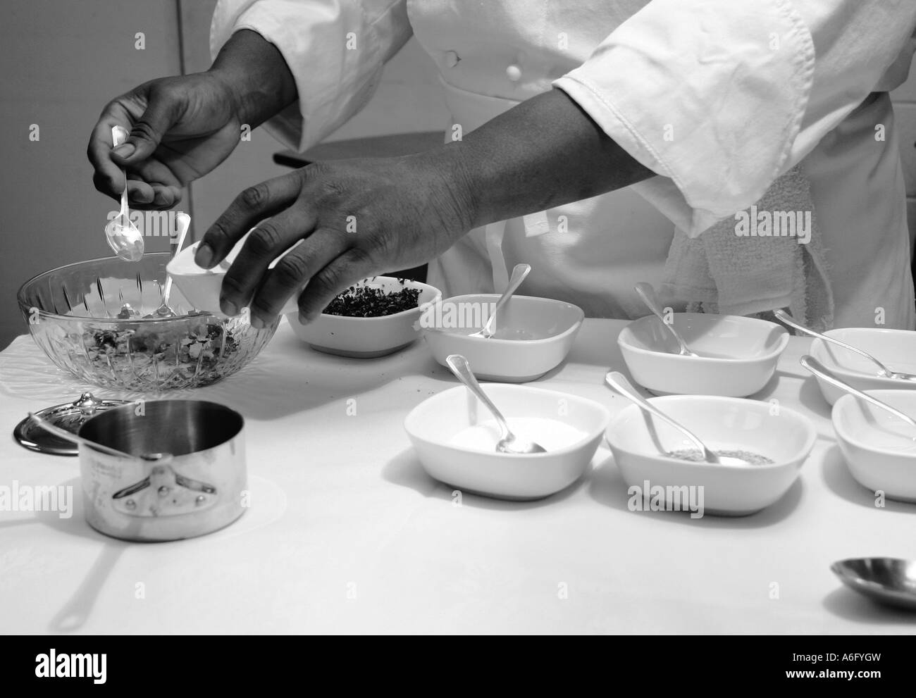 Chef preparing sauce in restaurant kitchen Stock Photo - Alamy