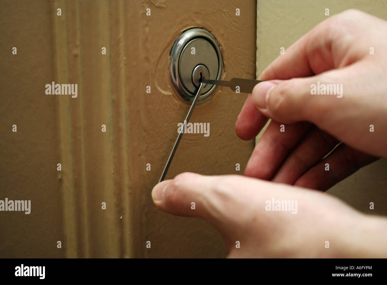 Picking lock with tools Stock Photo - Alamy