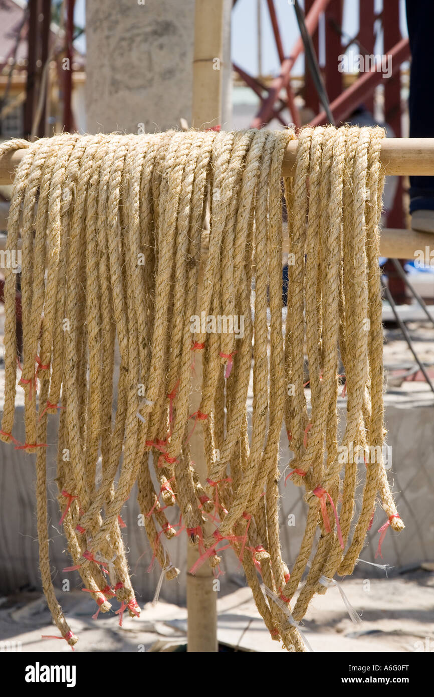 Male construction team of workmen assembling bamboo scaffolding Hemp ...