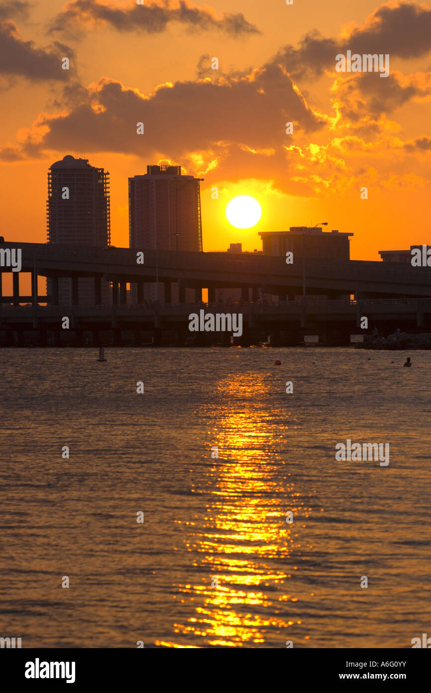 MIAMI FLORIDA USA Sun sets over water Biscayne Bay with buildings and ...