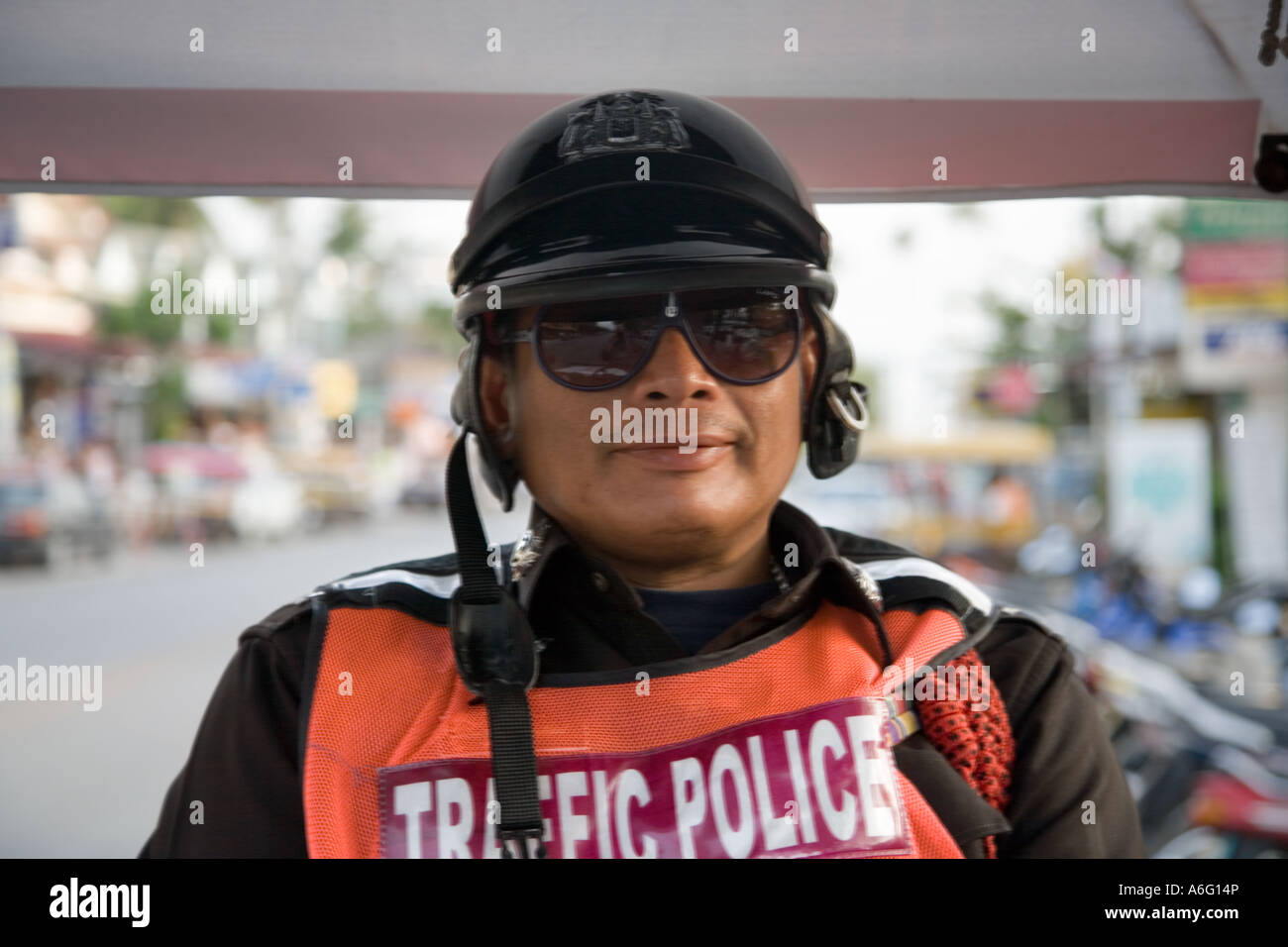 Traffic and Tourist Policeman smiling while sitting in open air vehicle ...