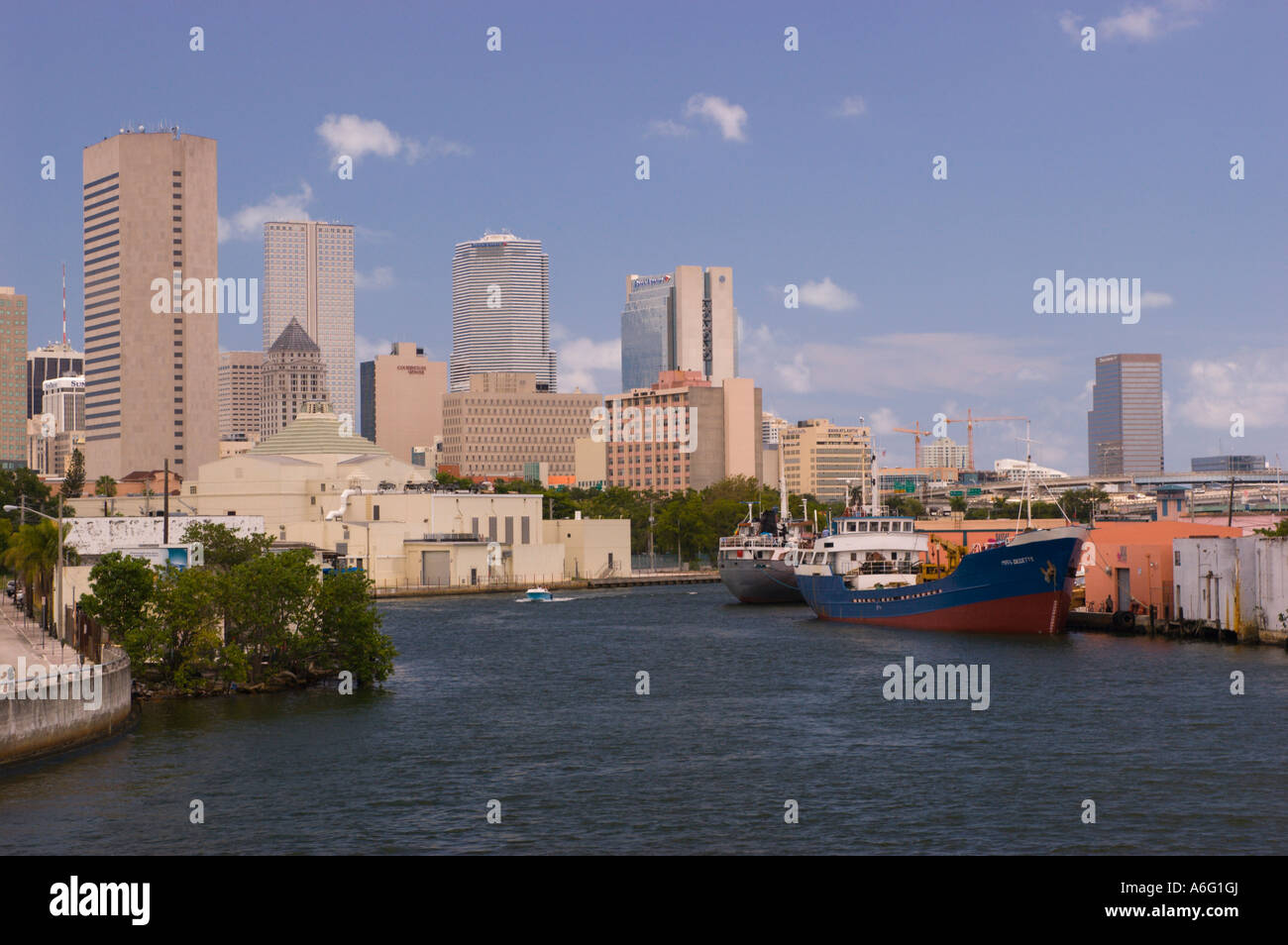 MIAMI FLORIDA USA Miami River with ships and downtown skyline at rear ...