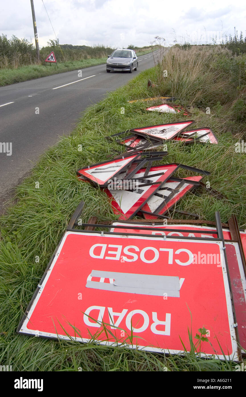 Road work and direction signs on the side of the road Stock Photo - Alamy