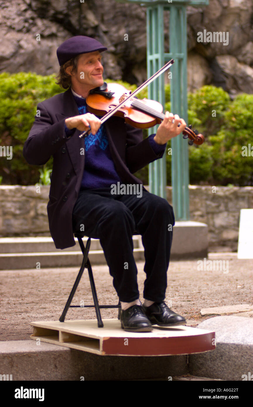 Folk musician plays playing violin performing hi-res stock photography ...