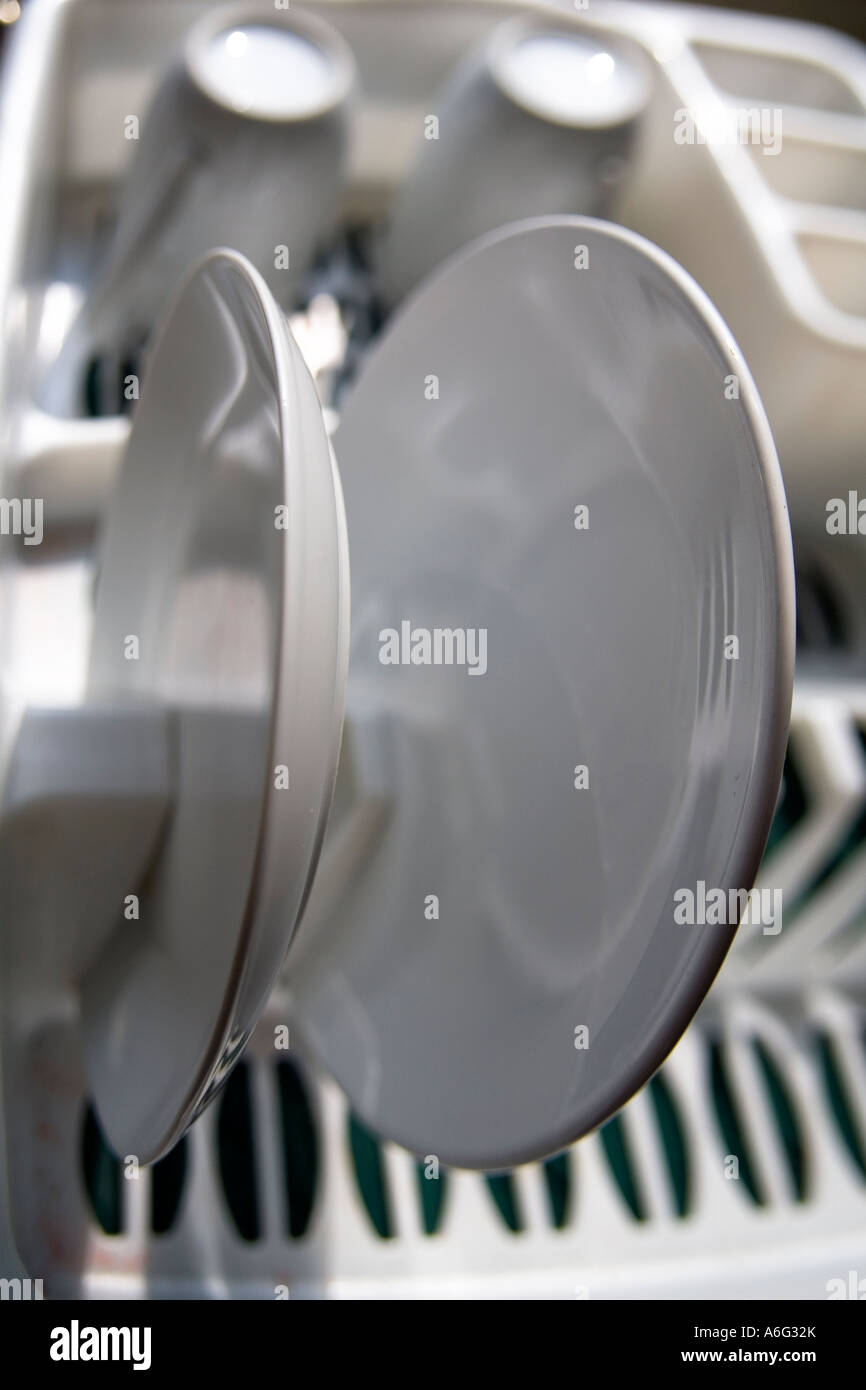 Draining or drying board with saucers and cups in it Stock Photo - Alamy