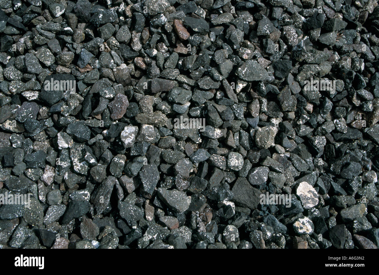 Abstract natural outdoors background image of small black stones or ...