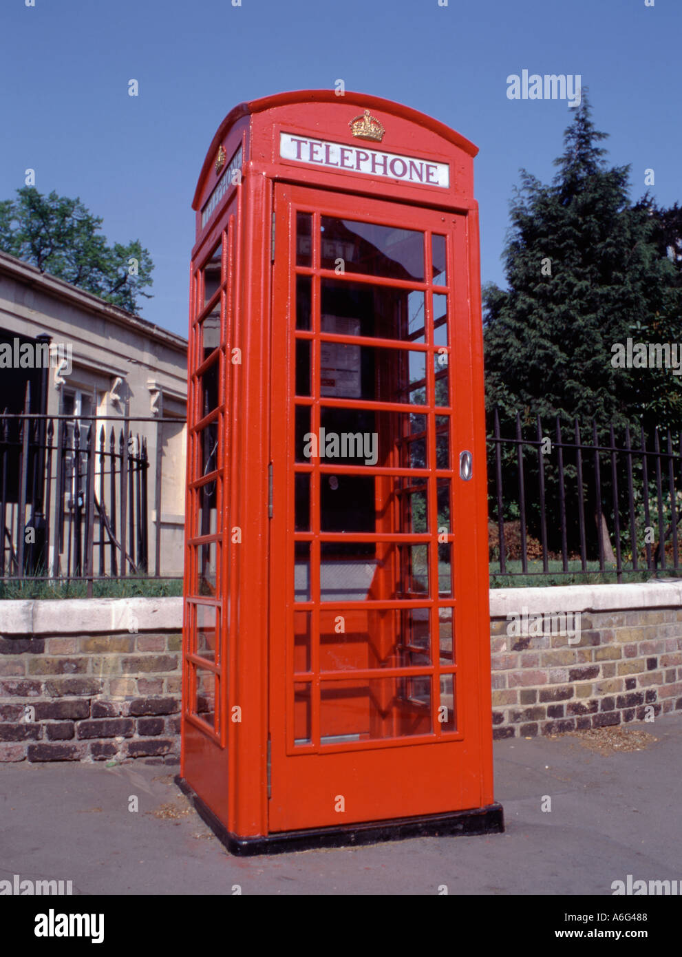 Classic red Gilbert Scott designed telephone box, London, England, UK ...