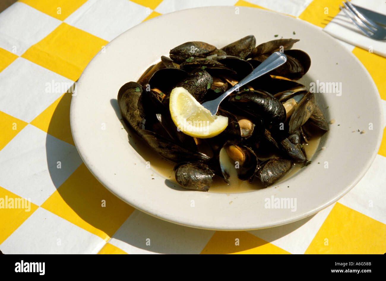 A plate of steamed mussels is seen at an outdoor restaurant at Harbour ...