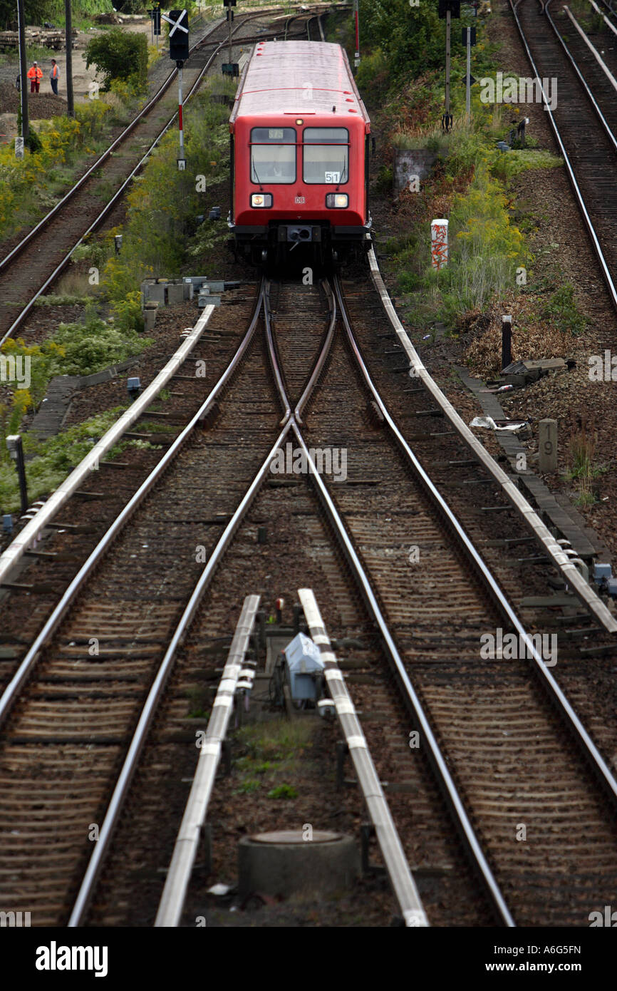 Suburban train at a switch point Stock Photo - Alamy