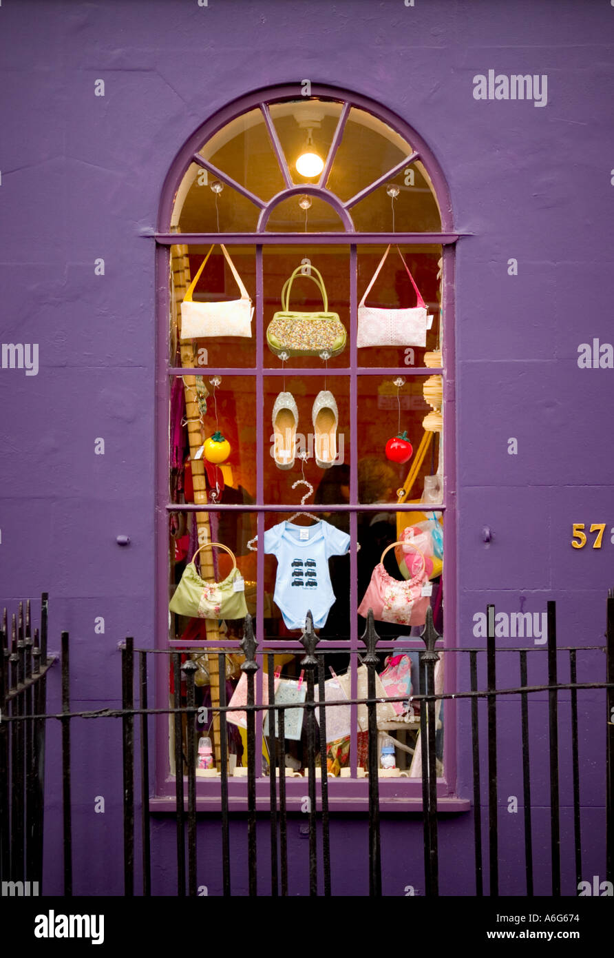 Busy shop window with bags and clothes Stock Photo - Alamy