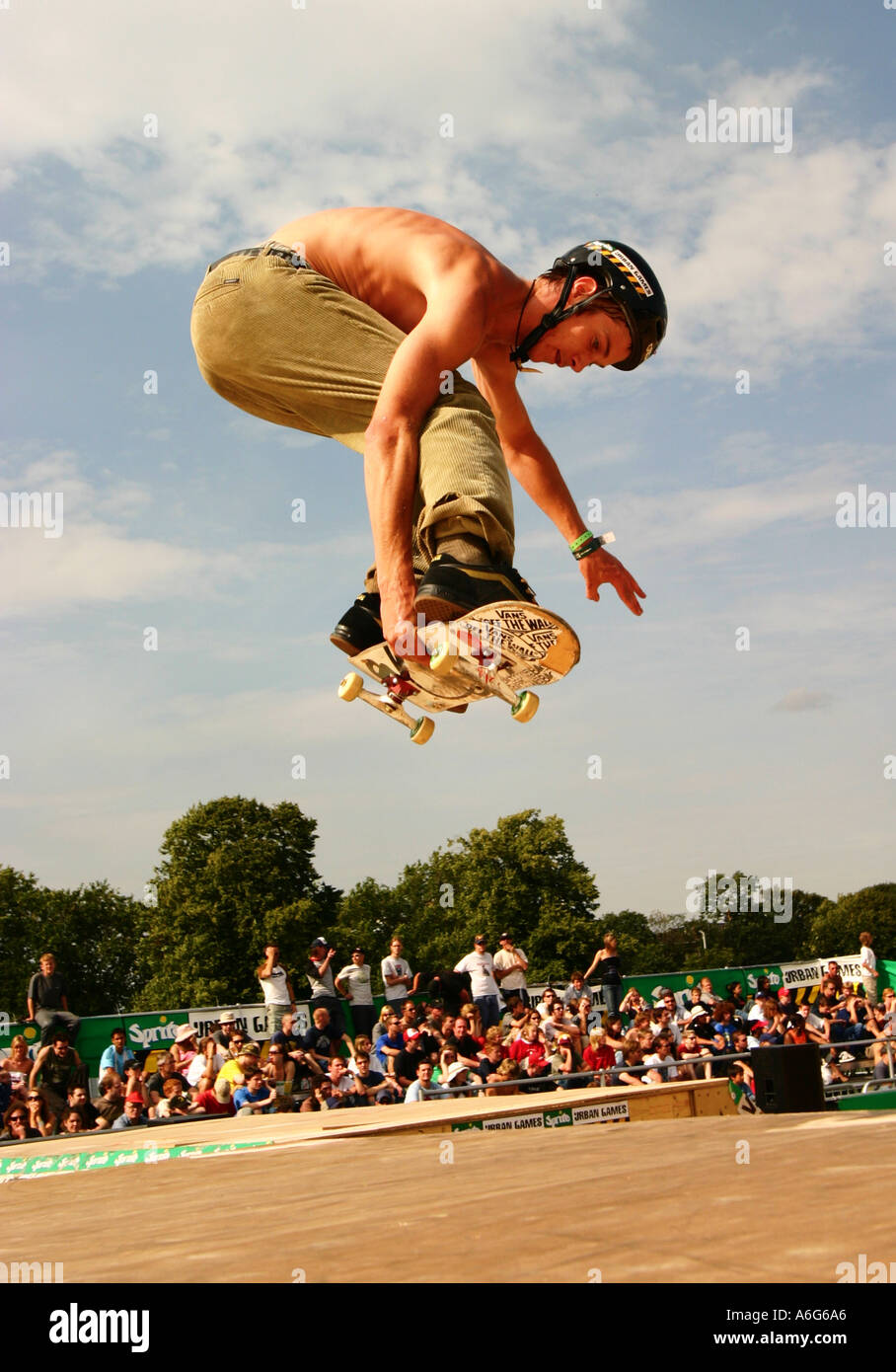 Skateboarder grab trick Stock Photo - Alamy