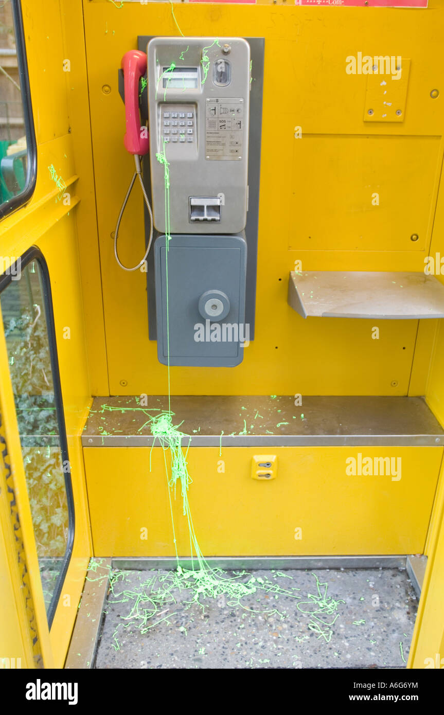 Dirty telephone box Stock Photo - Alamy