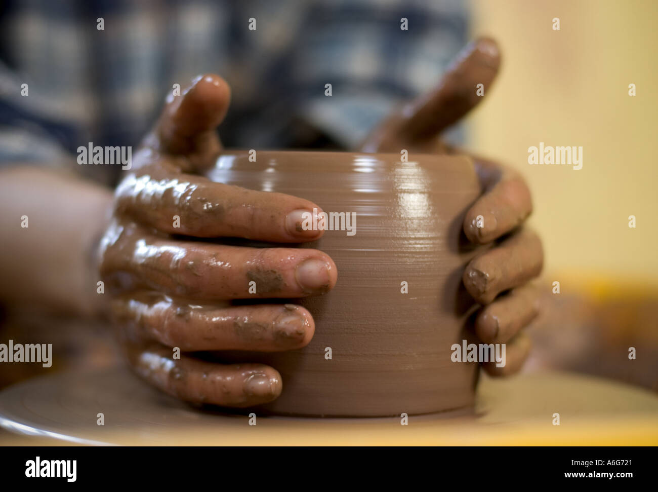 A woman throwing a pot Stock Photo - Alamy