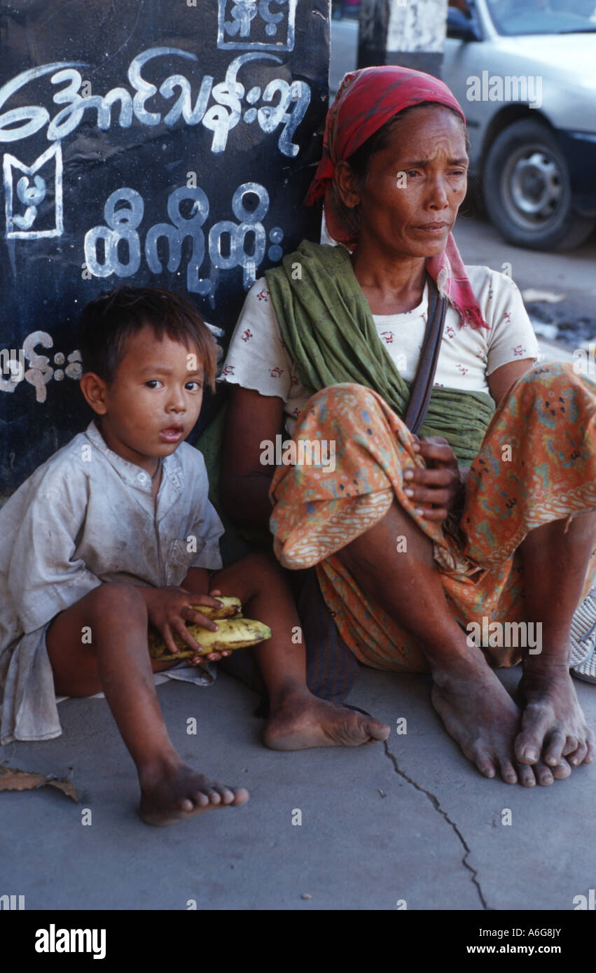 Homeless mother with her son beside the street hi-res stock photography ...