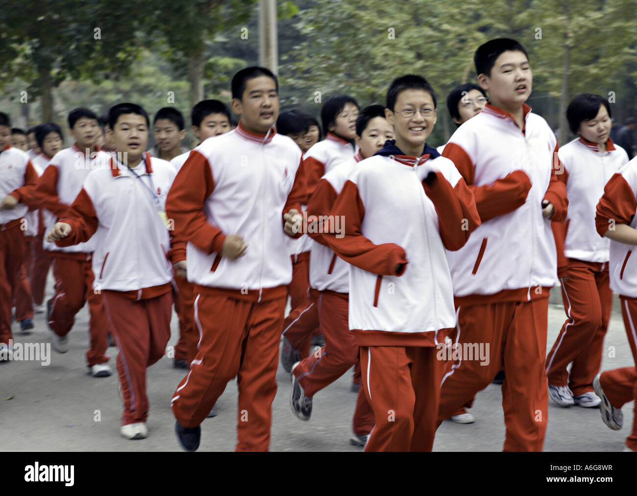 CHINA BEIJING Middle school physical education class students running ...