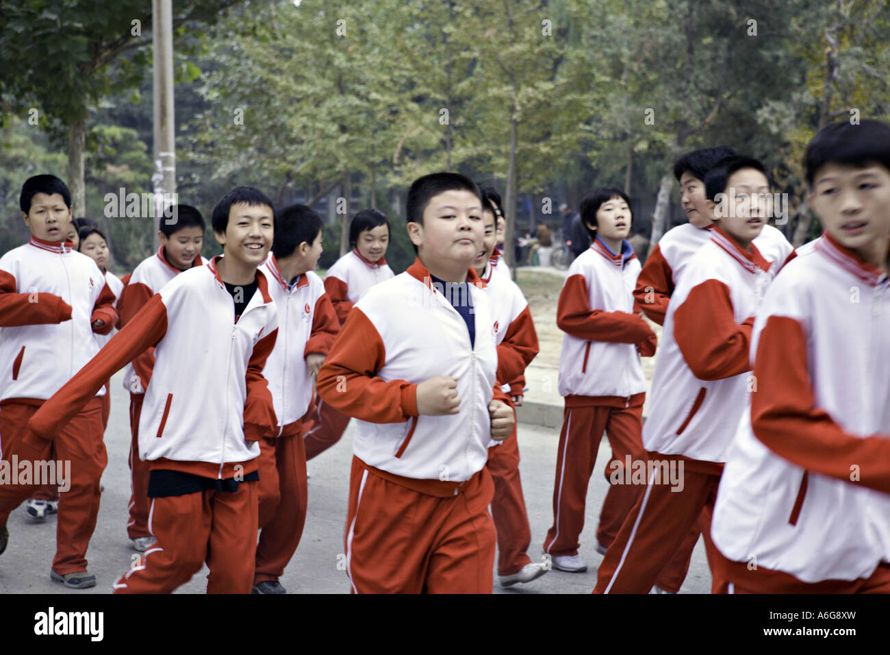 CHINA BEIJING Middle school physical education class students running ...