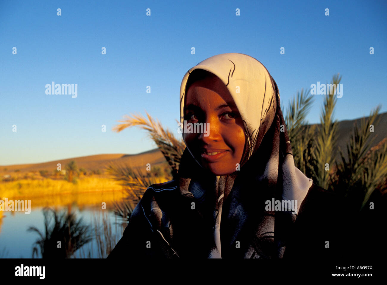 young Libyan woman in front of lake Gebroun, Libya Stock Photo - Alamy