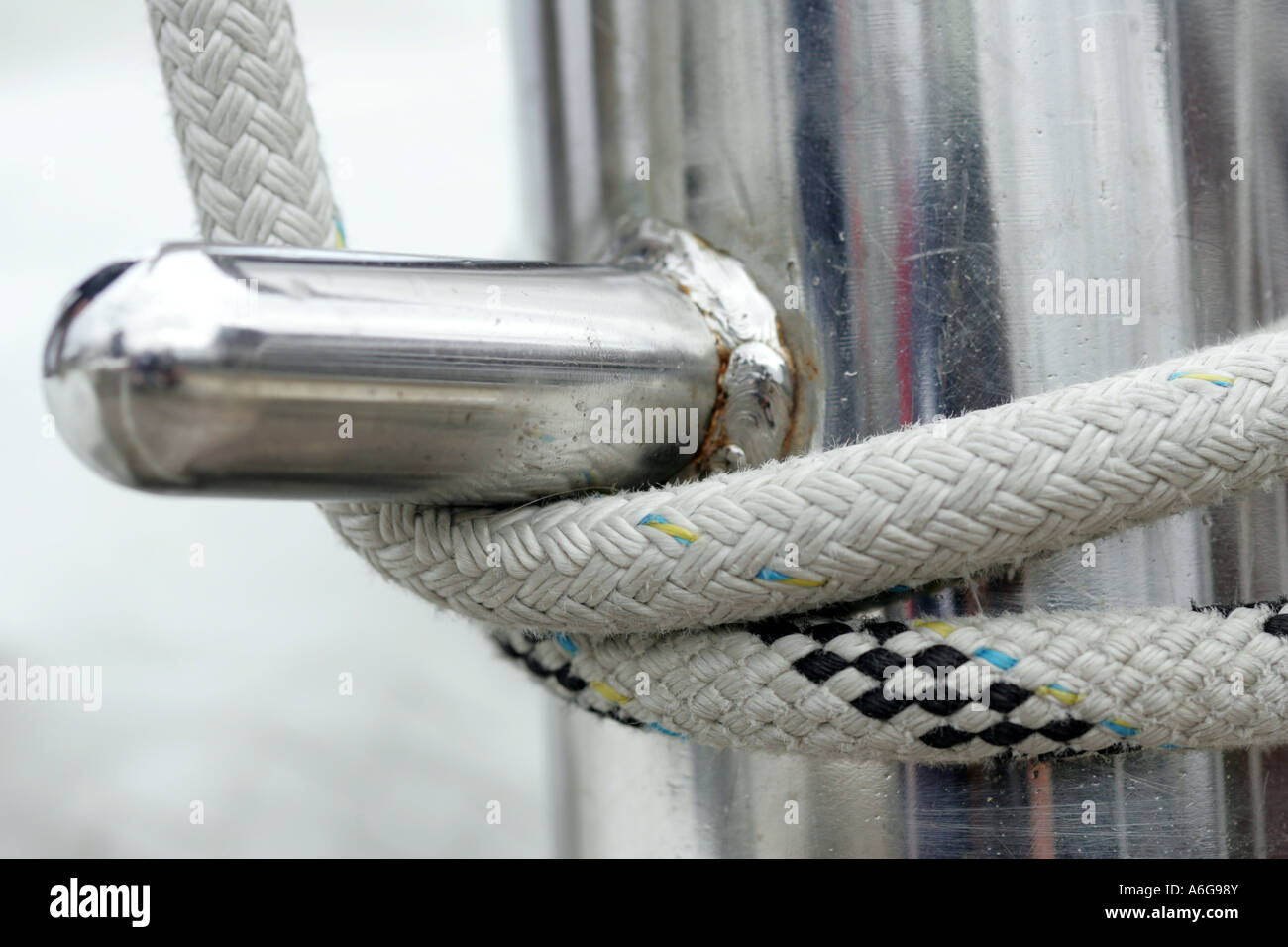 Sailing rope around a bollard Stock Photo - Alamy
