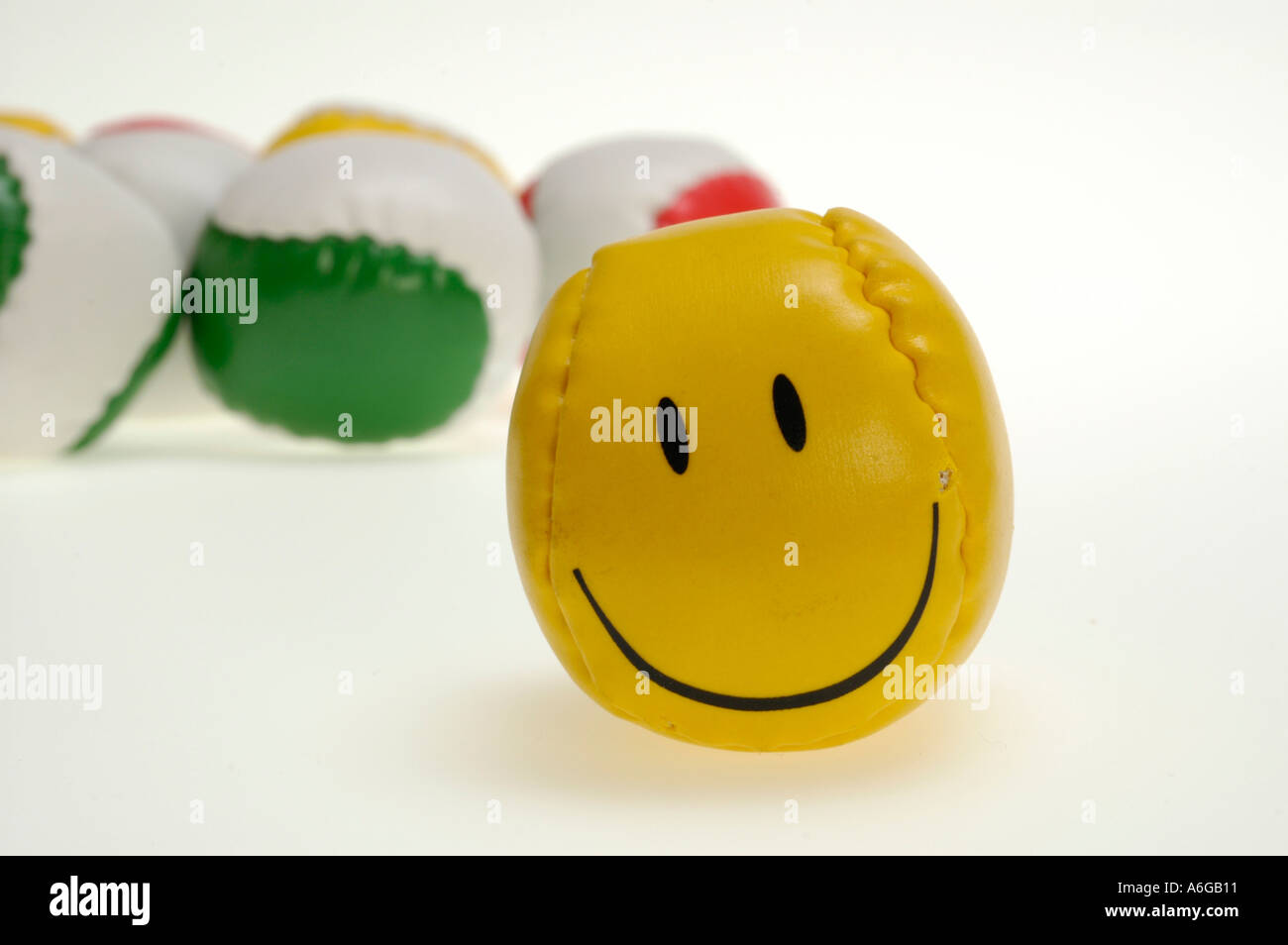 colourfull juggling balls, one smilie ball Stock Photo - Alamy