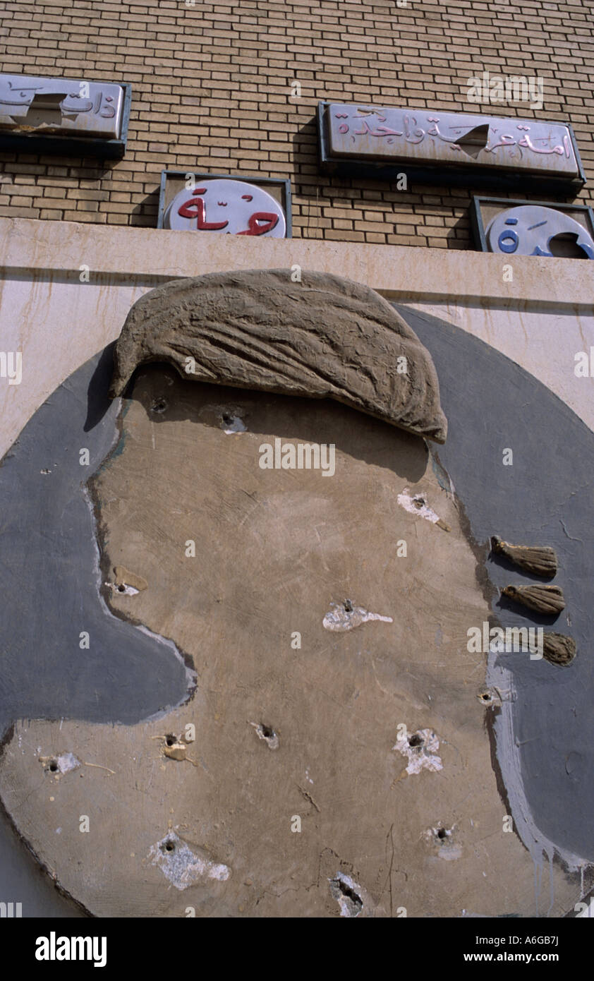 Baghdad Iraq 2003 Defaced portrait of Saddam Hussein Stock Photo - Alamy