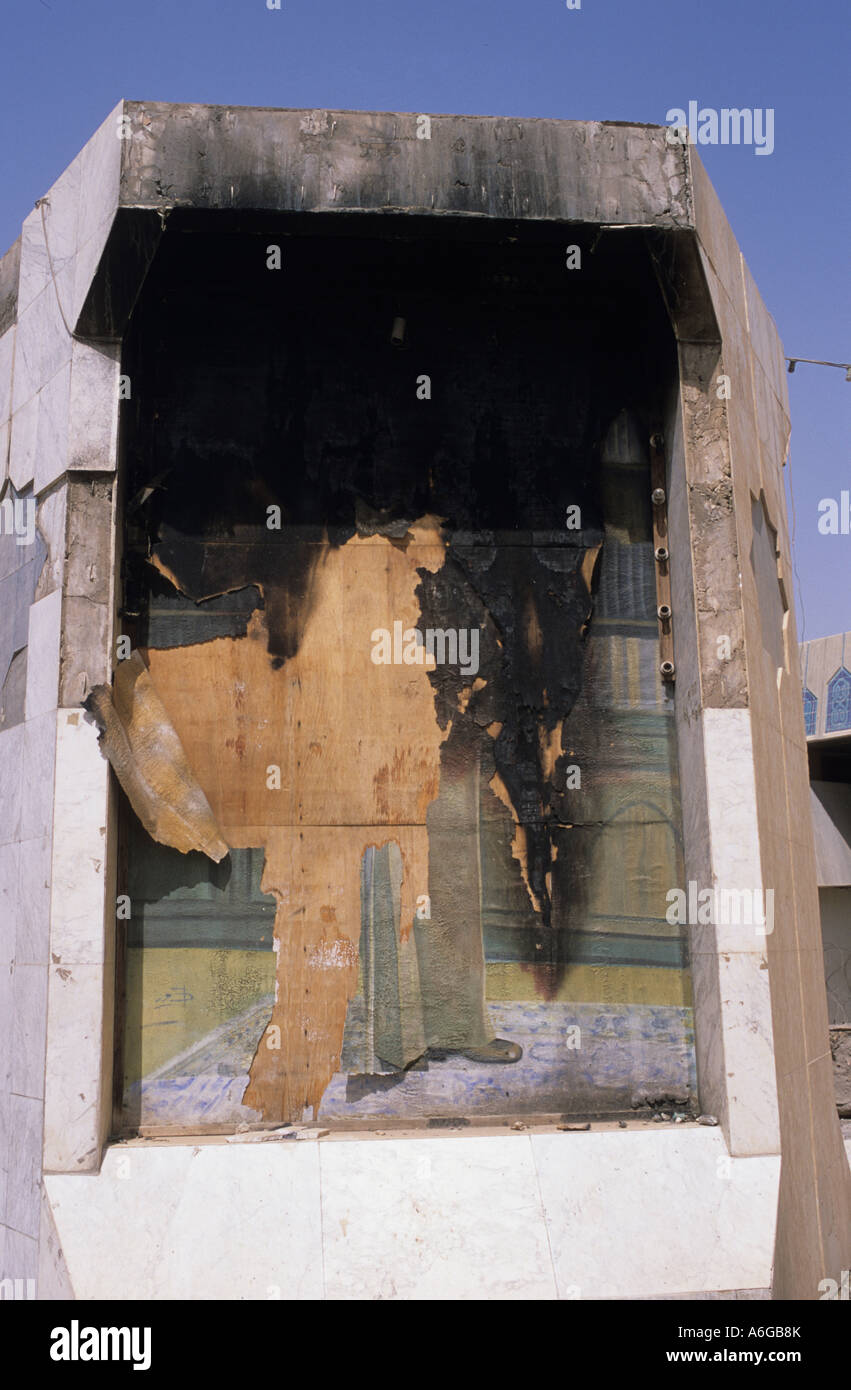 Baghdad Iraq 2003 Defaced portrait of Saddam Hussein Stock Photo - Alamy