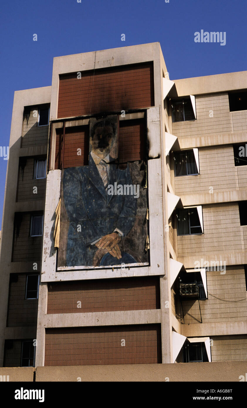 Baghdad Iraq 2003 Defaced portrait of Saddam Hussein Stock Photo - Alamy
