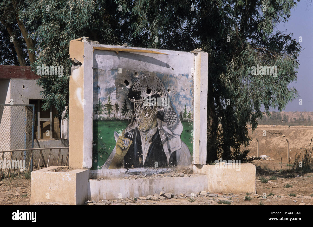 Baghdad Iraq 2003 Defaced portrait of Saddam Hussein Stock Photo - Alamy