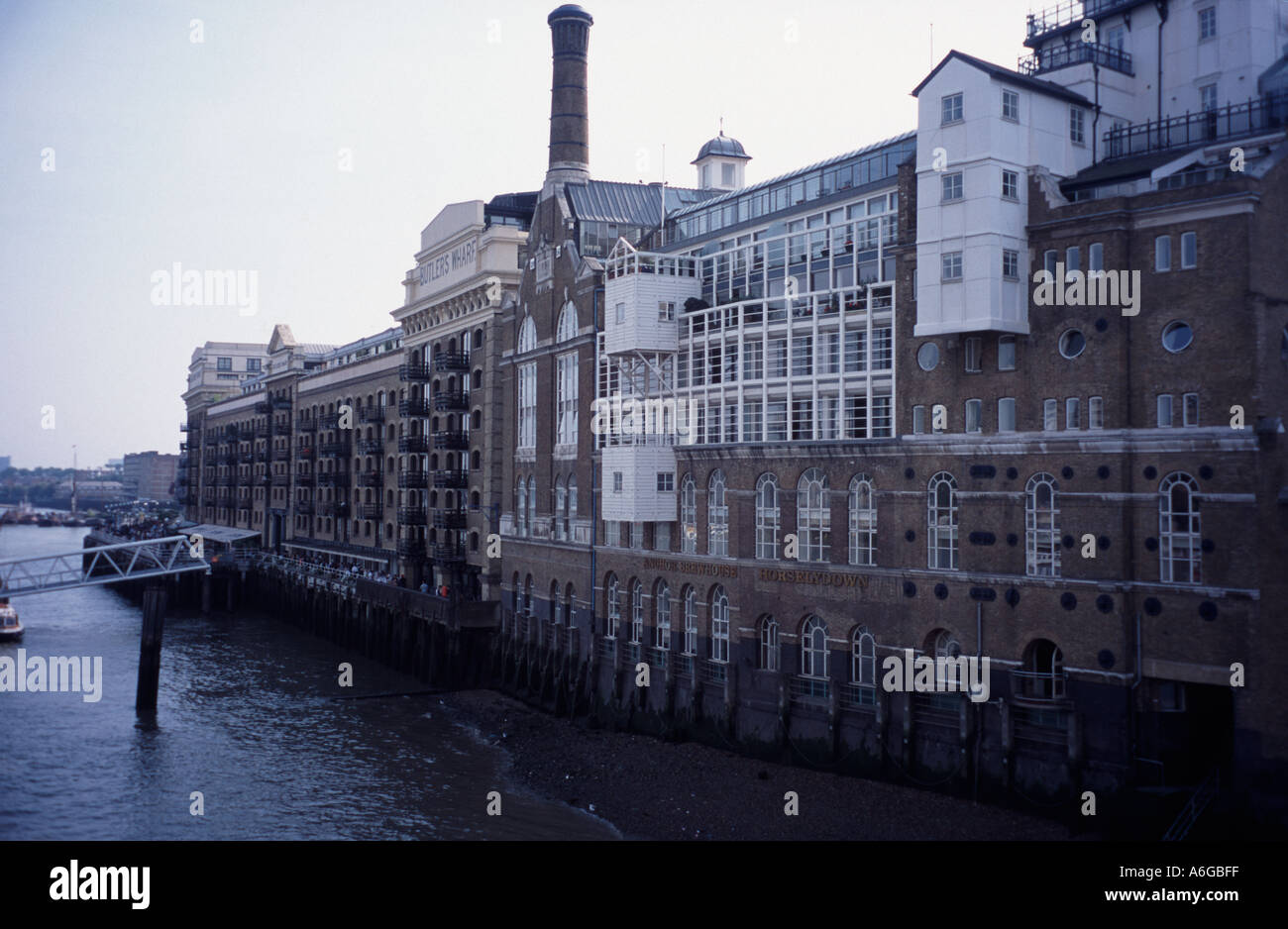 Wharf on River Thames near Tower Bridge, London, England UK Stock Photo ...