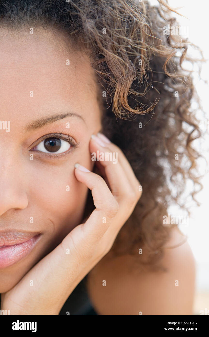 Woman leaning on hand Stock Photo - Alamy