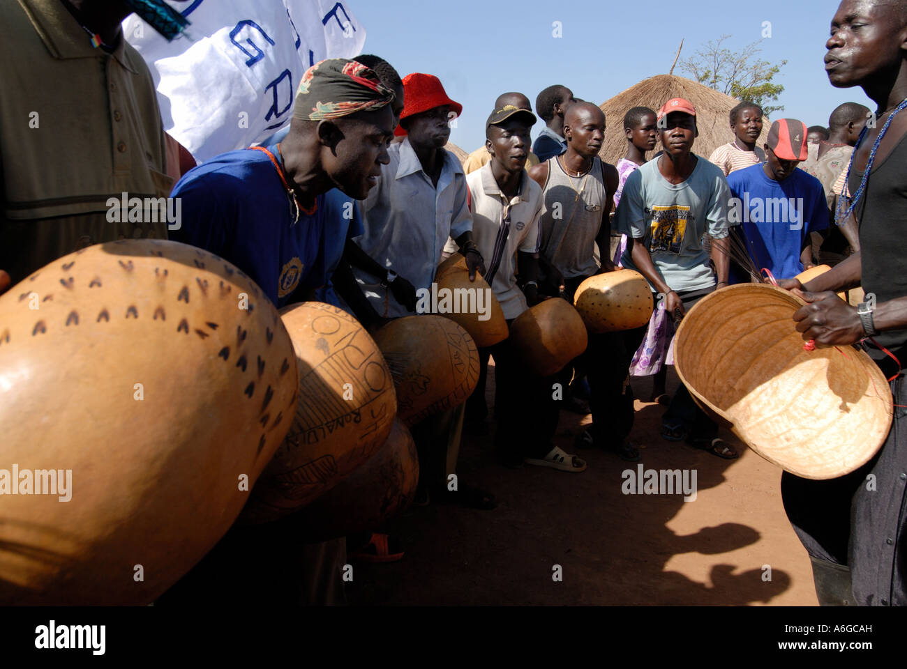 Displaced camp Lira Uganda . Villagers play traditional music on large ...