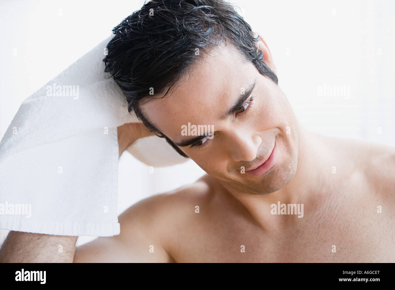 Man drying his hair Stock Photo - Alamy