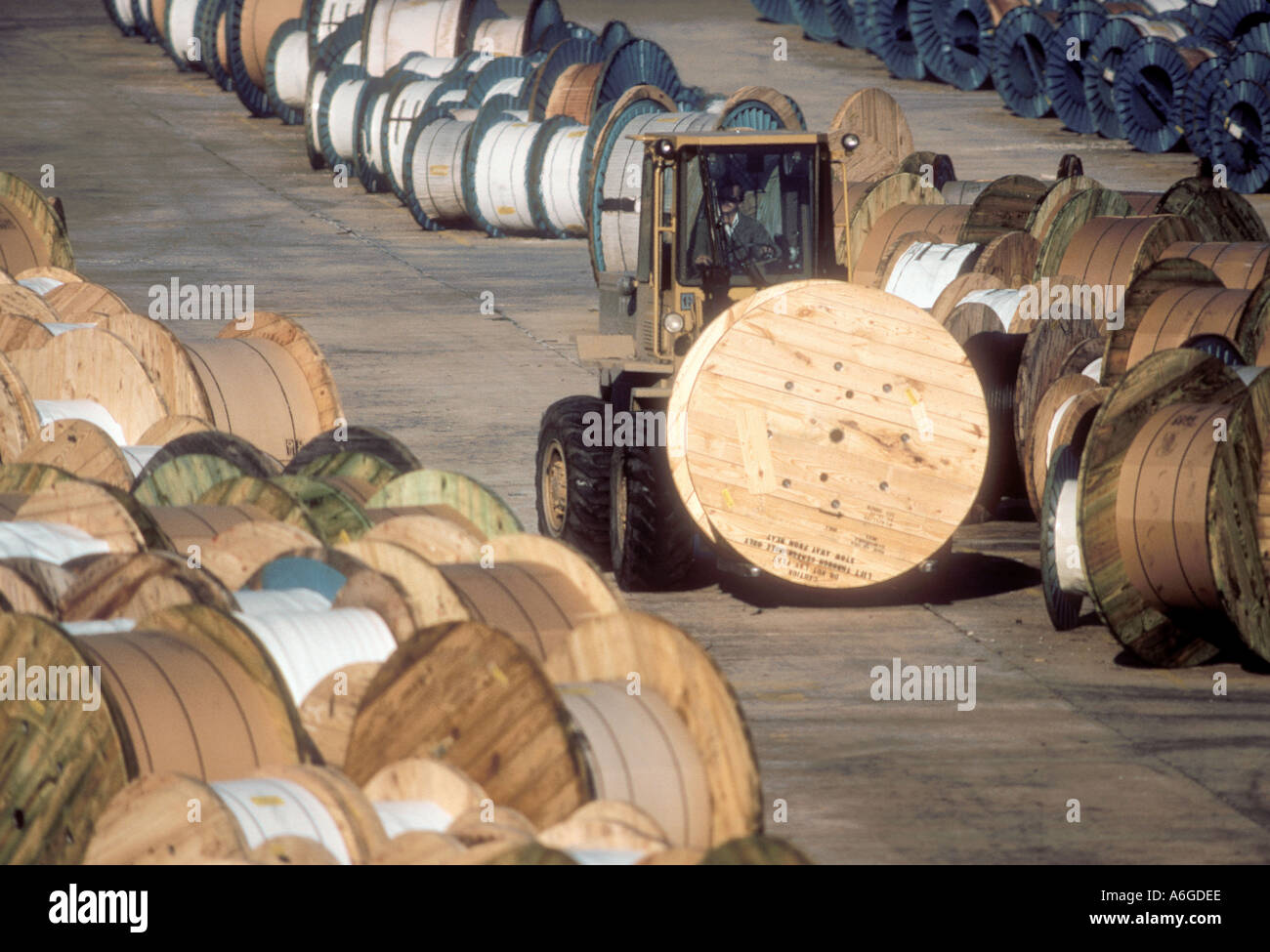 Rolls of wire cable being moved in manufacturing plant in north Atlanta ...